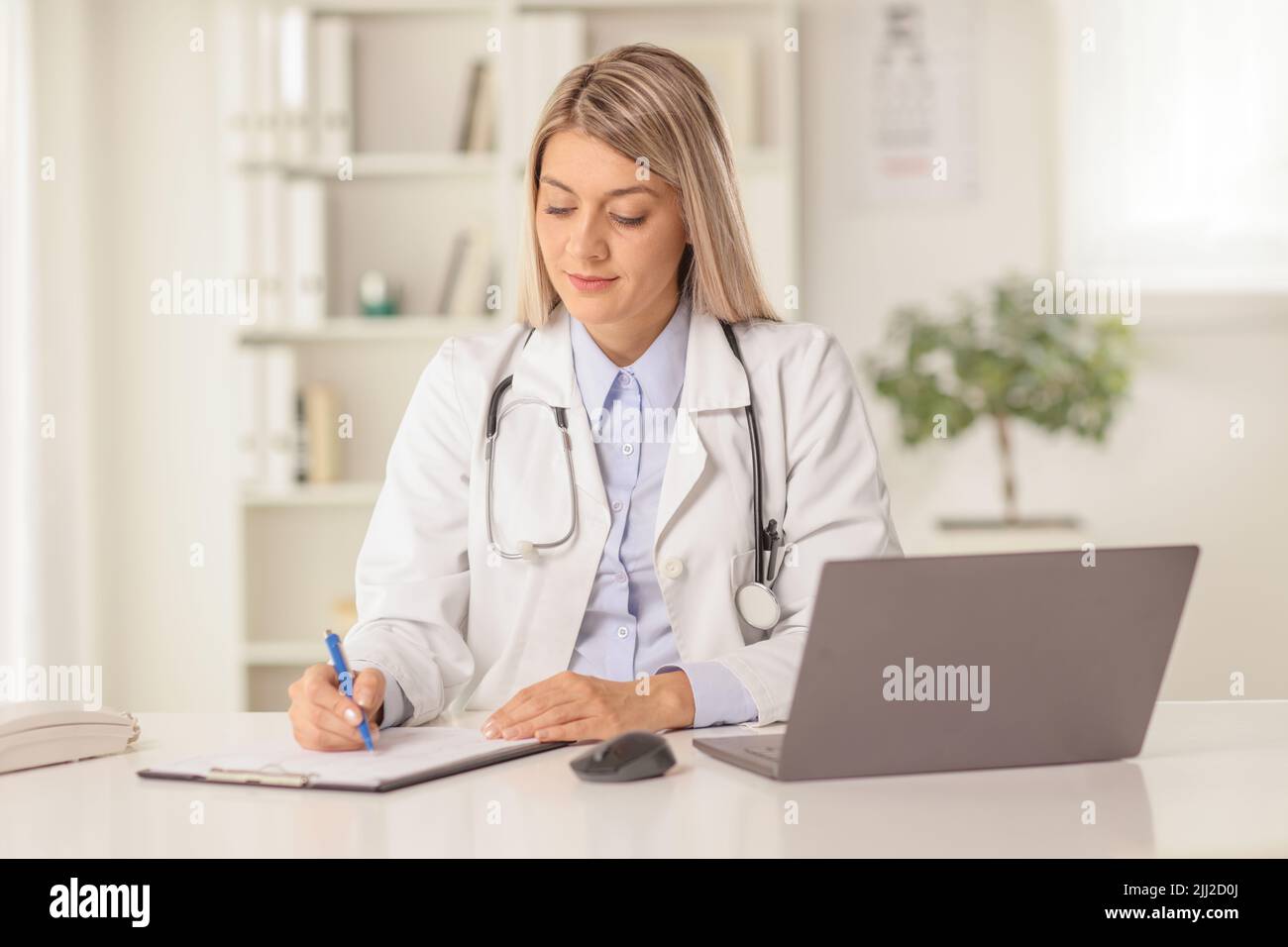 Female doctor stethoscope seated hi-res stock photography and images ...
