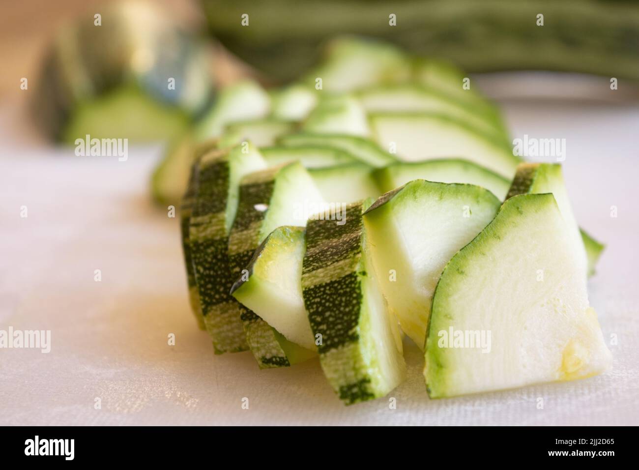 zucchini cut in pieces as ingredient for soup Stock Photo - Alamy