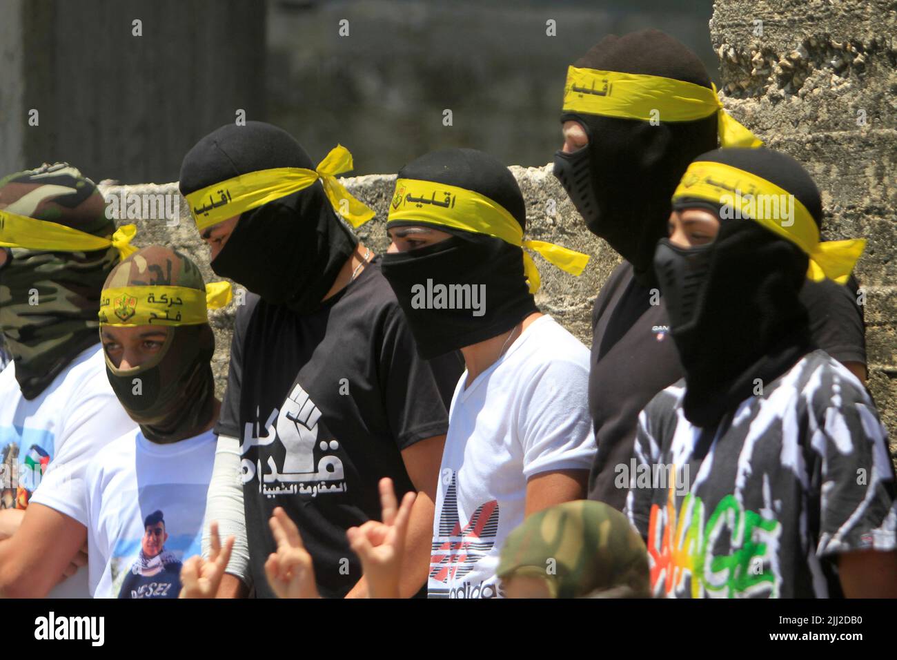 Masked Palestinian protesters seen during the demonstration against ...