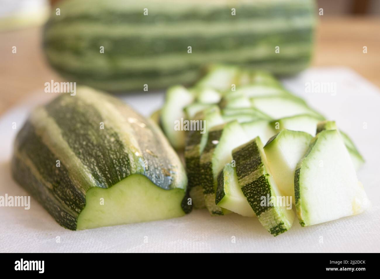 zucchini cut in pieces as ingredient for soup Stock Photo - Alamy