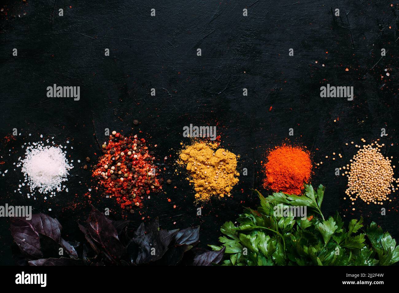food spice mix organic dark background Stock Photo - Alamy