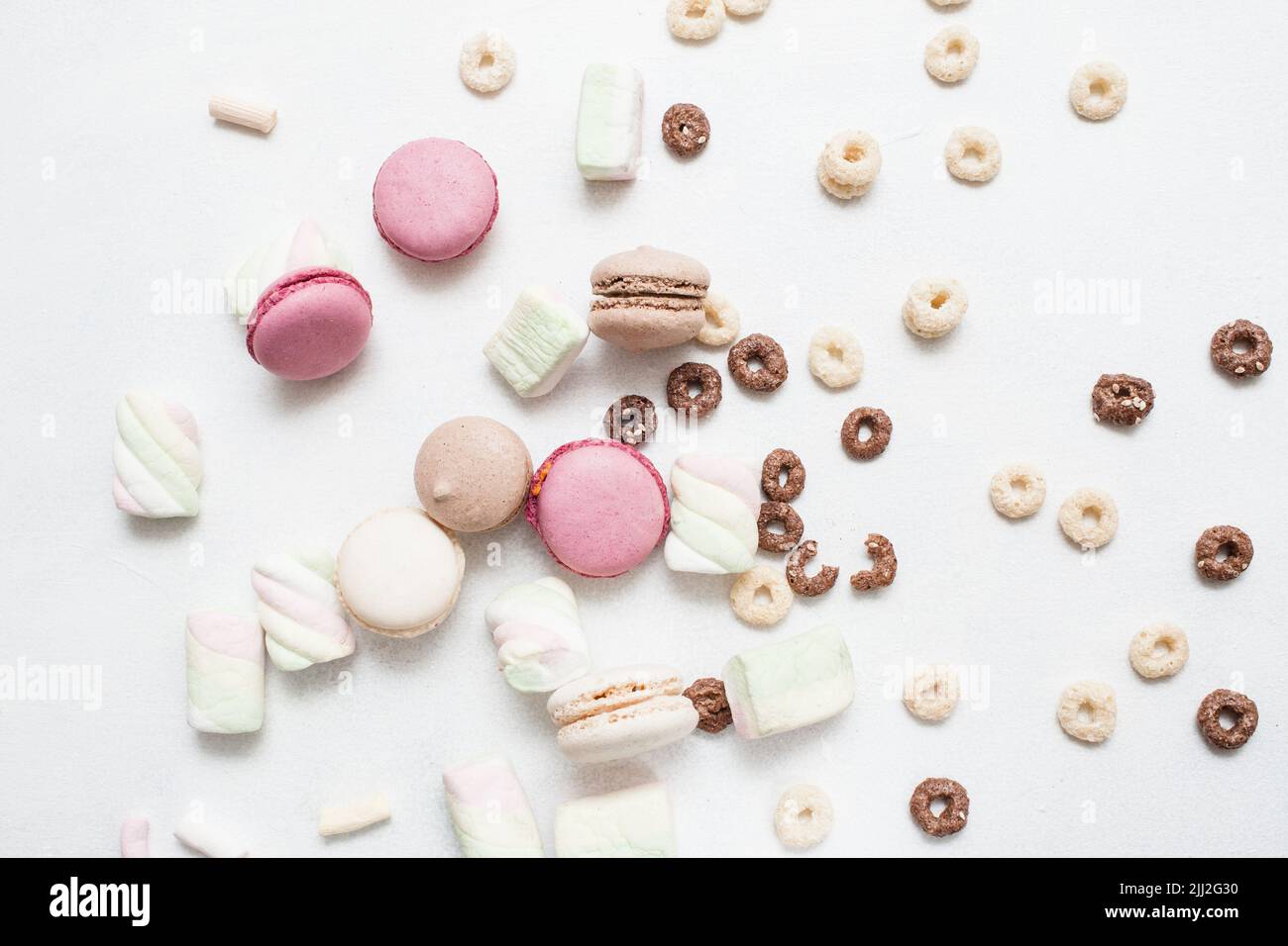 Top view of sweets on white background Stock Photo - Alamy