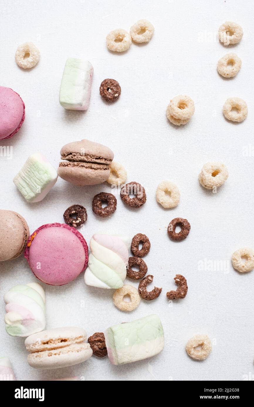 Colorful sweets on white background top view Stock Photo - Alamy