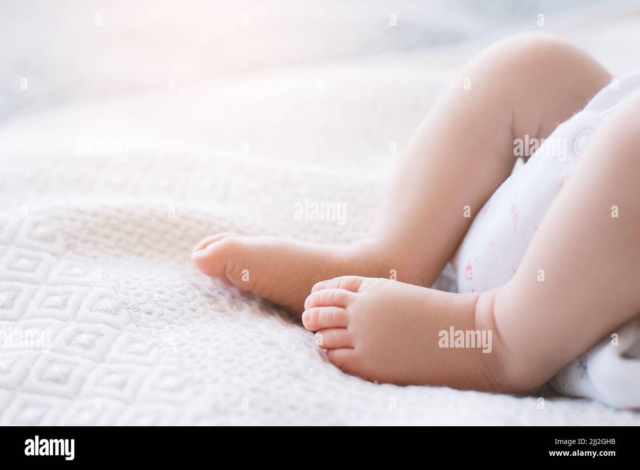 little newborn baby feet white background Stock Photo - Alamy