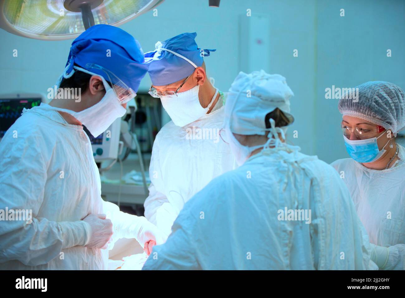 Surgeons during the operation. Professional doctors performing ...