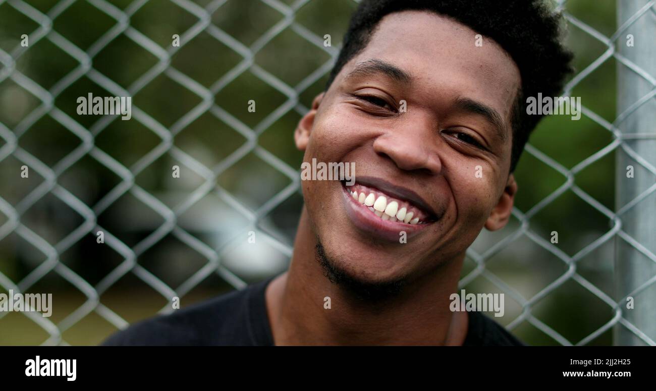African american black guy smiling and feeling happy Stock Photo - Alamy
