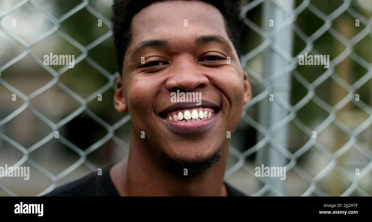 African american black guy smiling and feeling happy Stock Photo - Alamy