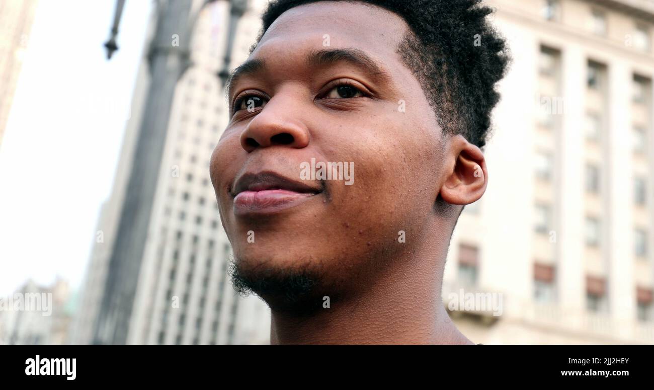 African black man smiling and laughing outside, real authentic people ...