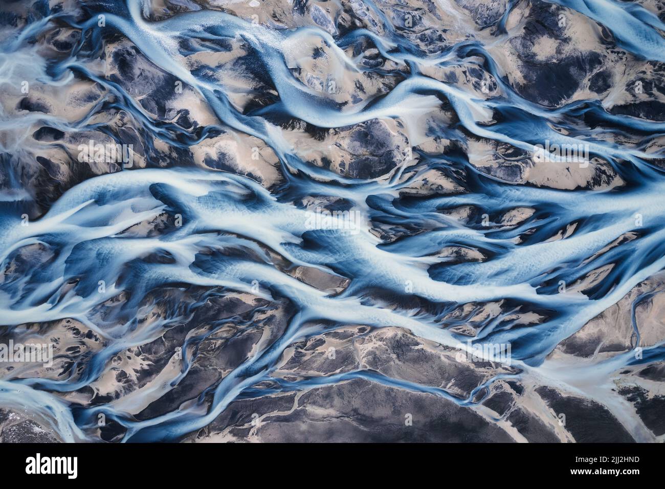 Aerial drone view of abstract beautiful glacier rivers pattern on earth ...