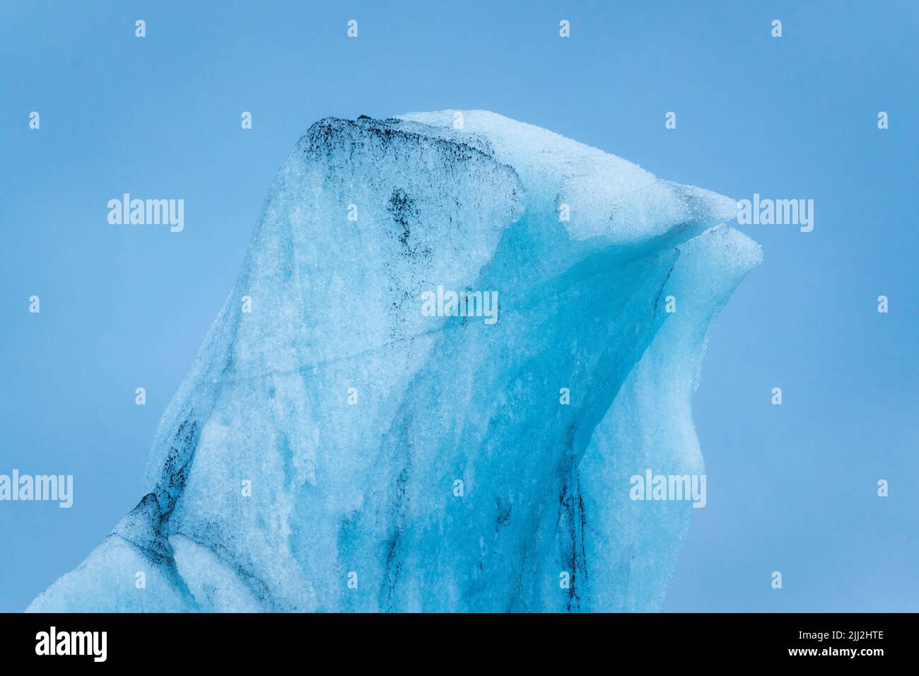 Blue iceberg floating on glacier lagoon from Breiðamerkurjökull glacier ...