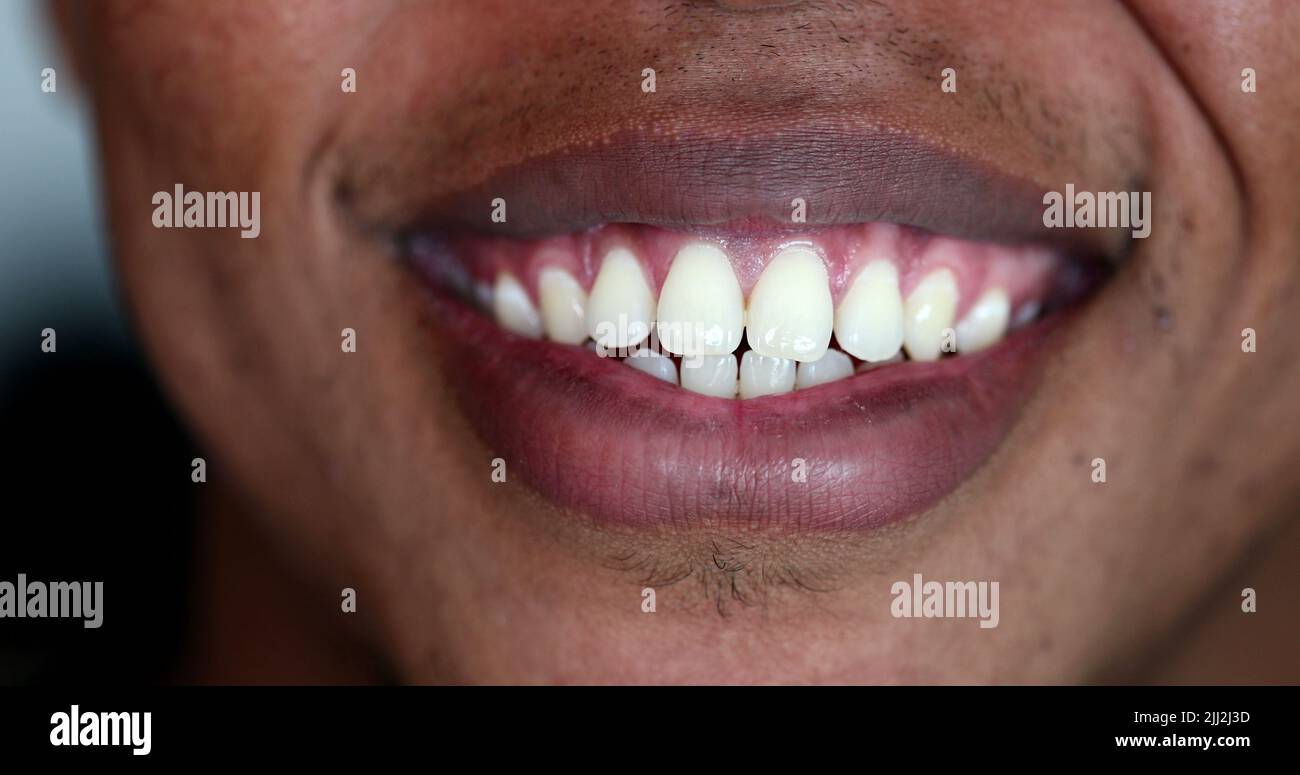 African person mouth smiling close-up, white teeth Stock Photo - Alamy