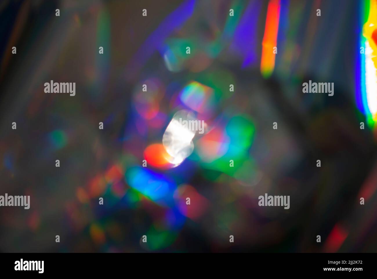 Shining background of colorful bokeh with a holographic effect. The ...