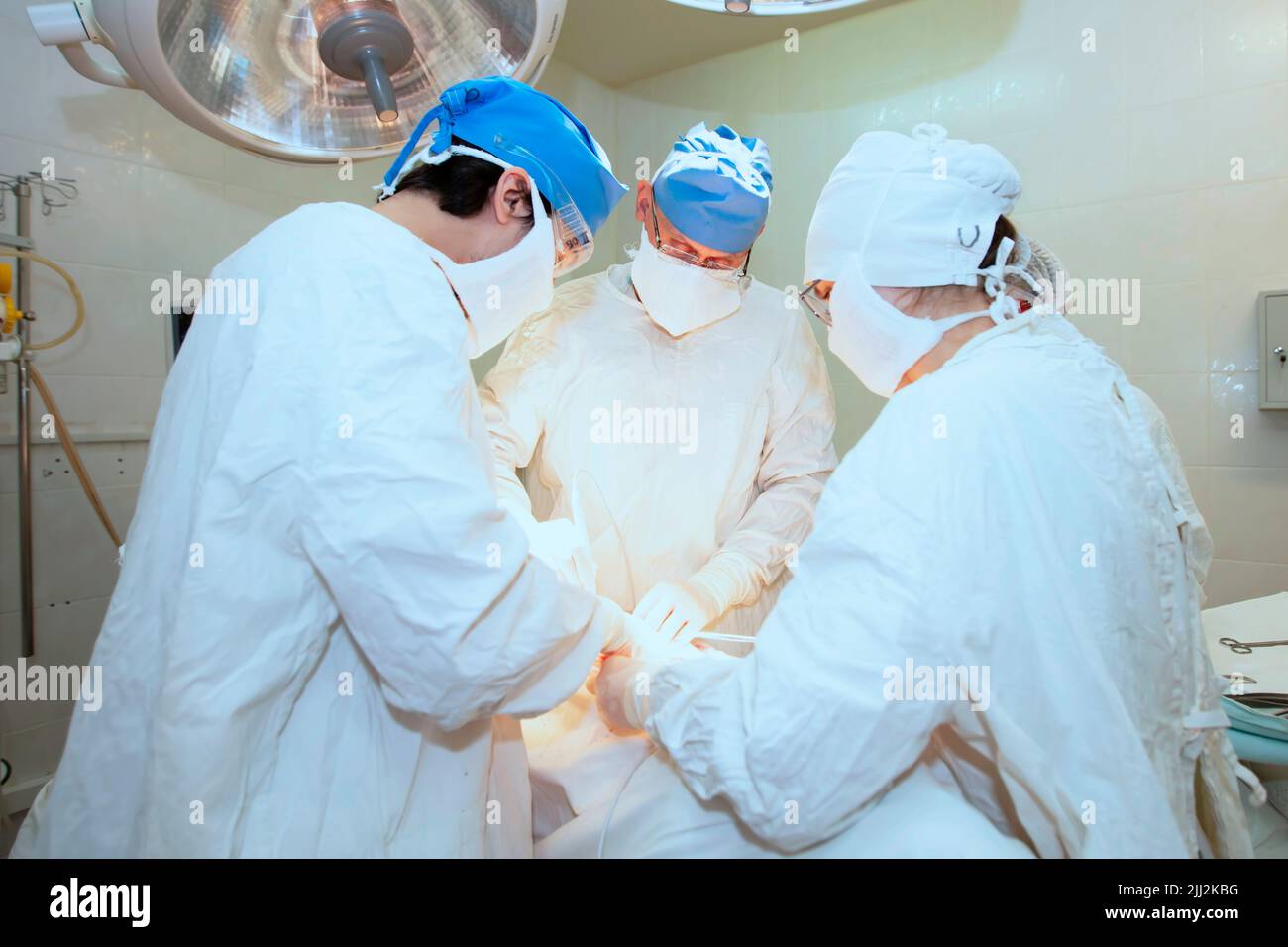 Surgeons during the operation. Professional doctors performing ...