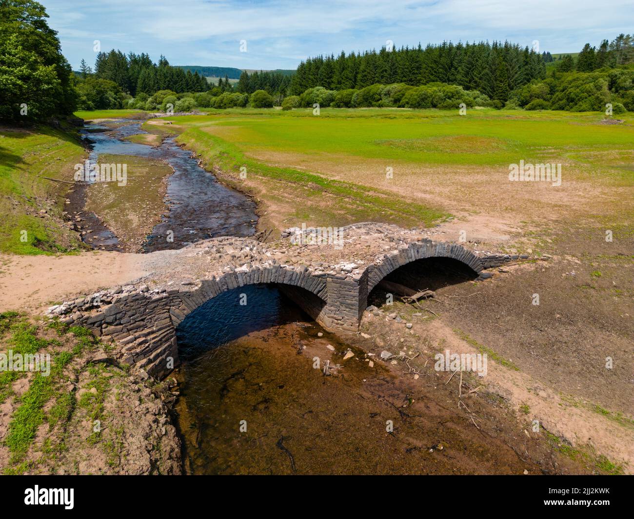 Aerial view of a normally submerged bridge at a near empty reservoir ...