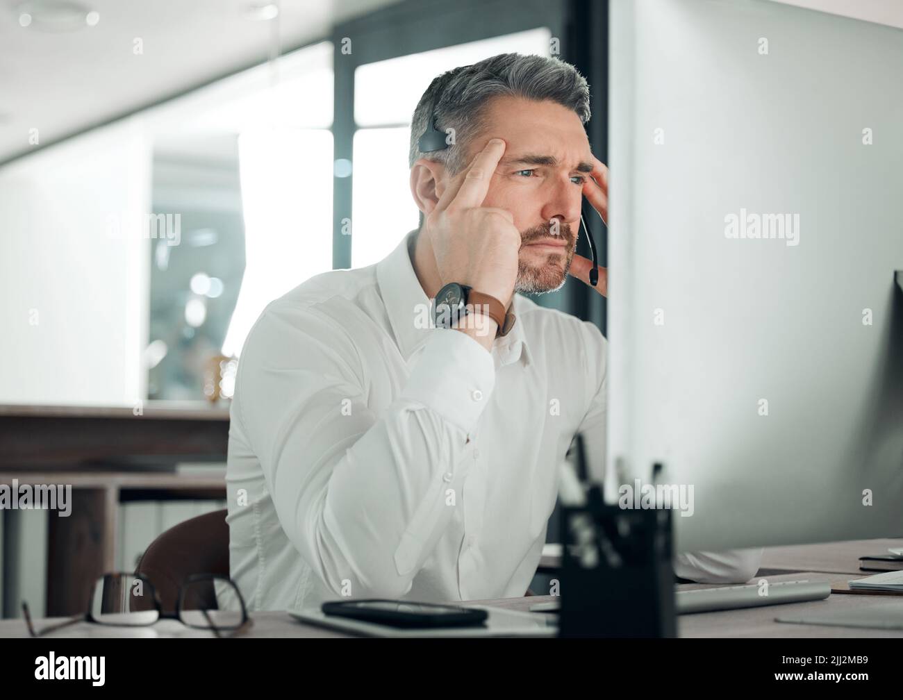 Stressed businessman looking around feeling hi-res stock photography ...