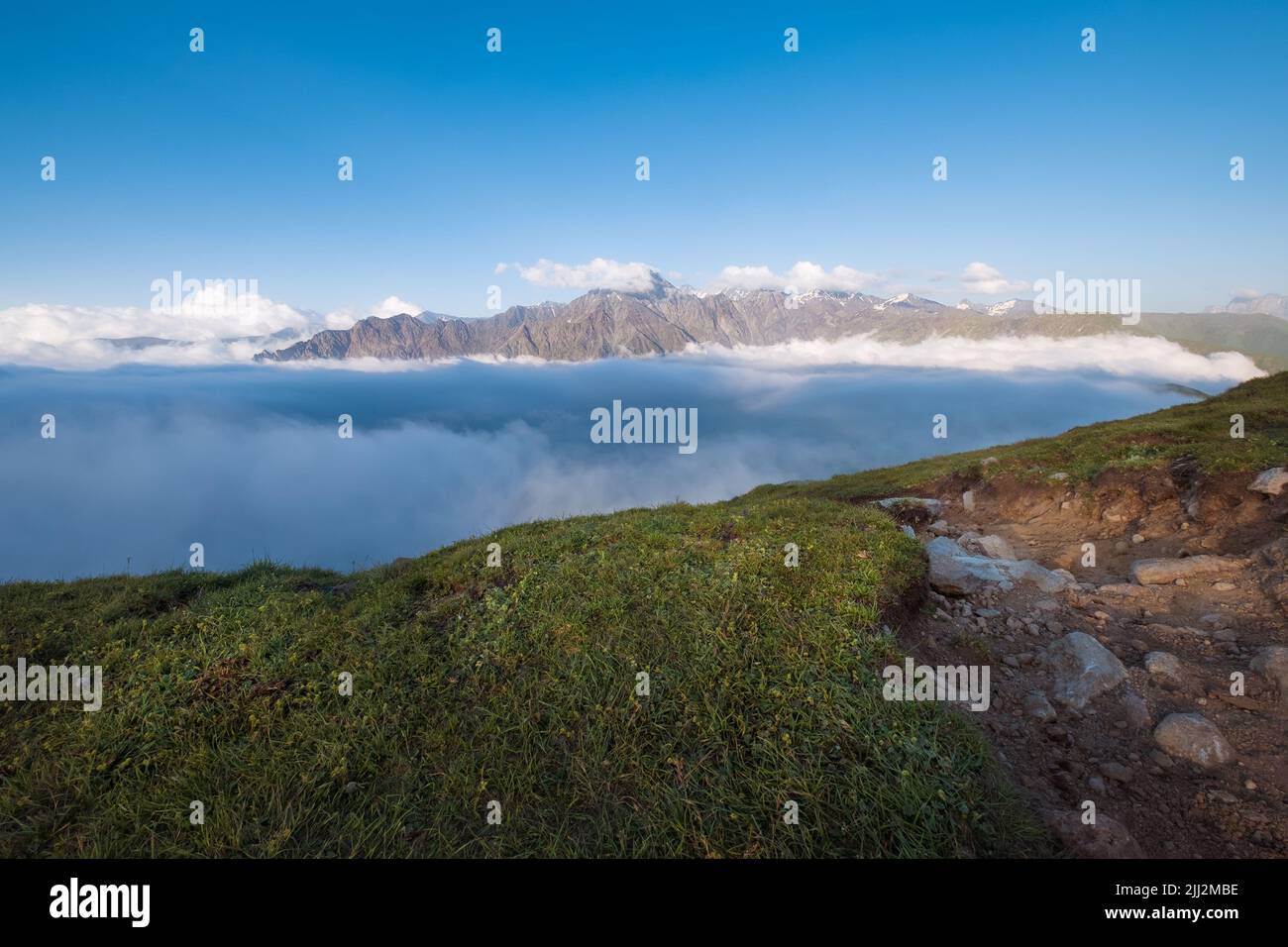 Greater Caucasus mountains covered with evening clouds with Mount Shani ...