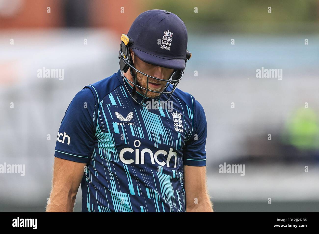A dejected David Willey of England leaves the field after being caught ...