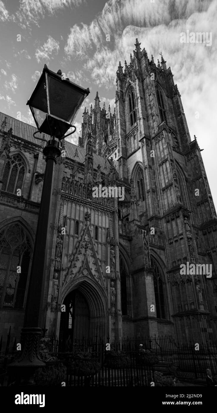 Beverley Minster behind a historic lamppost, set against a sky with ...