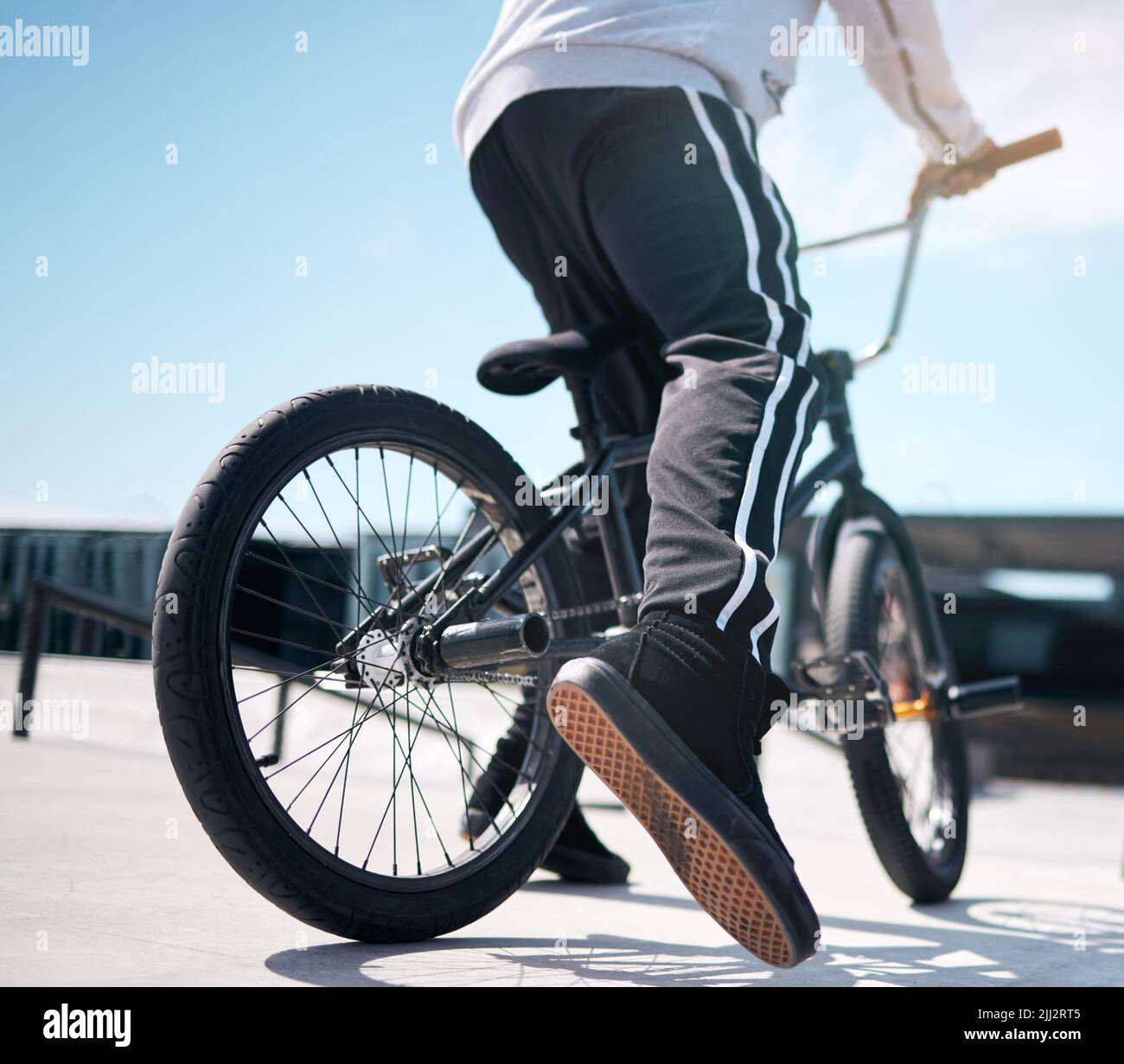 Hes off. an unrecognizable man riding his BMX outside Stock Photo - Alamy