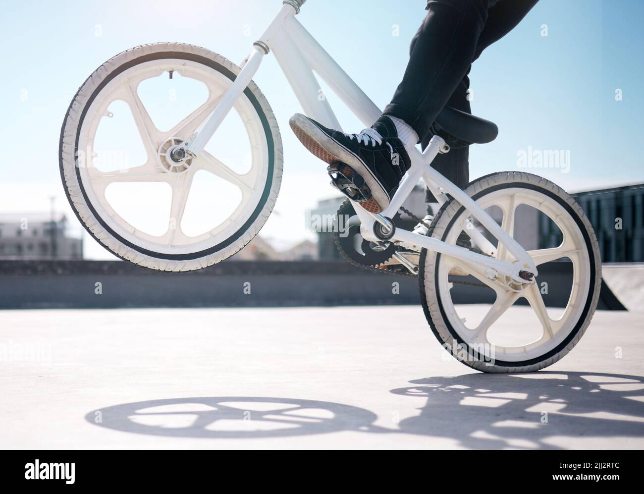 Hes tricked out. an unrecognizable man riding his BMX outside Stock ...