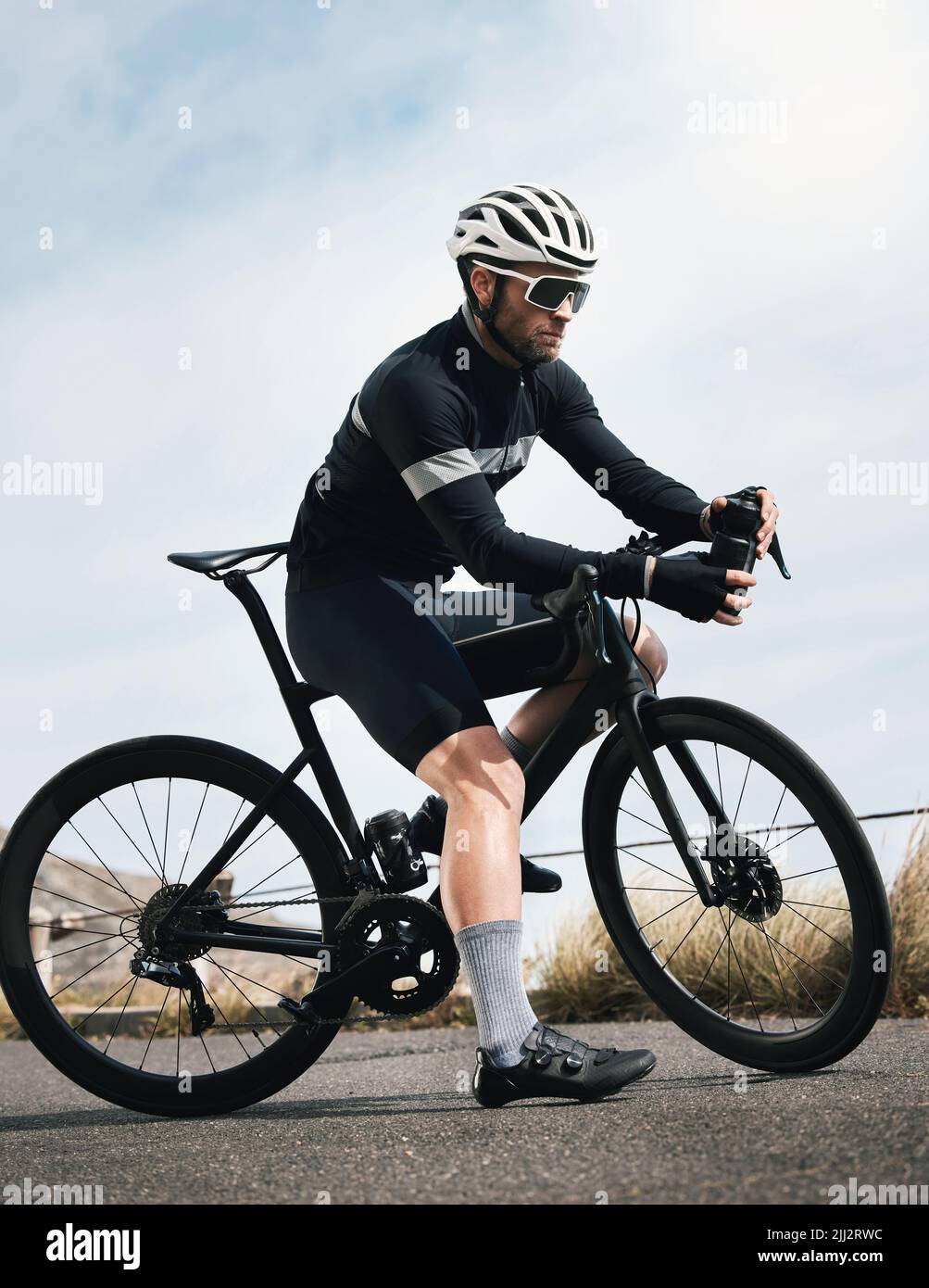 Water break. Full length shot of a handsome mature man taking a water ...