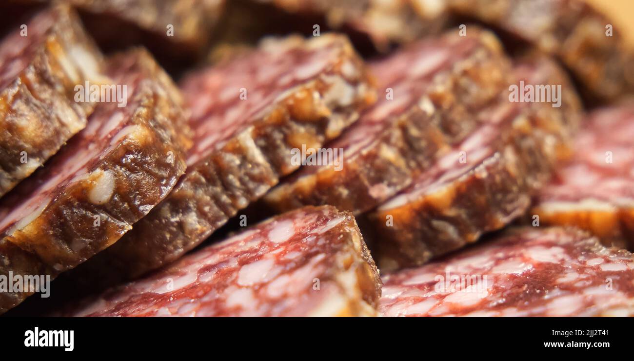Delicious meat appetizer. Chunks of dried sausage Stock Photo - Alamy