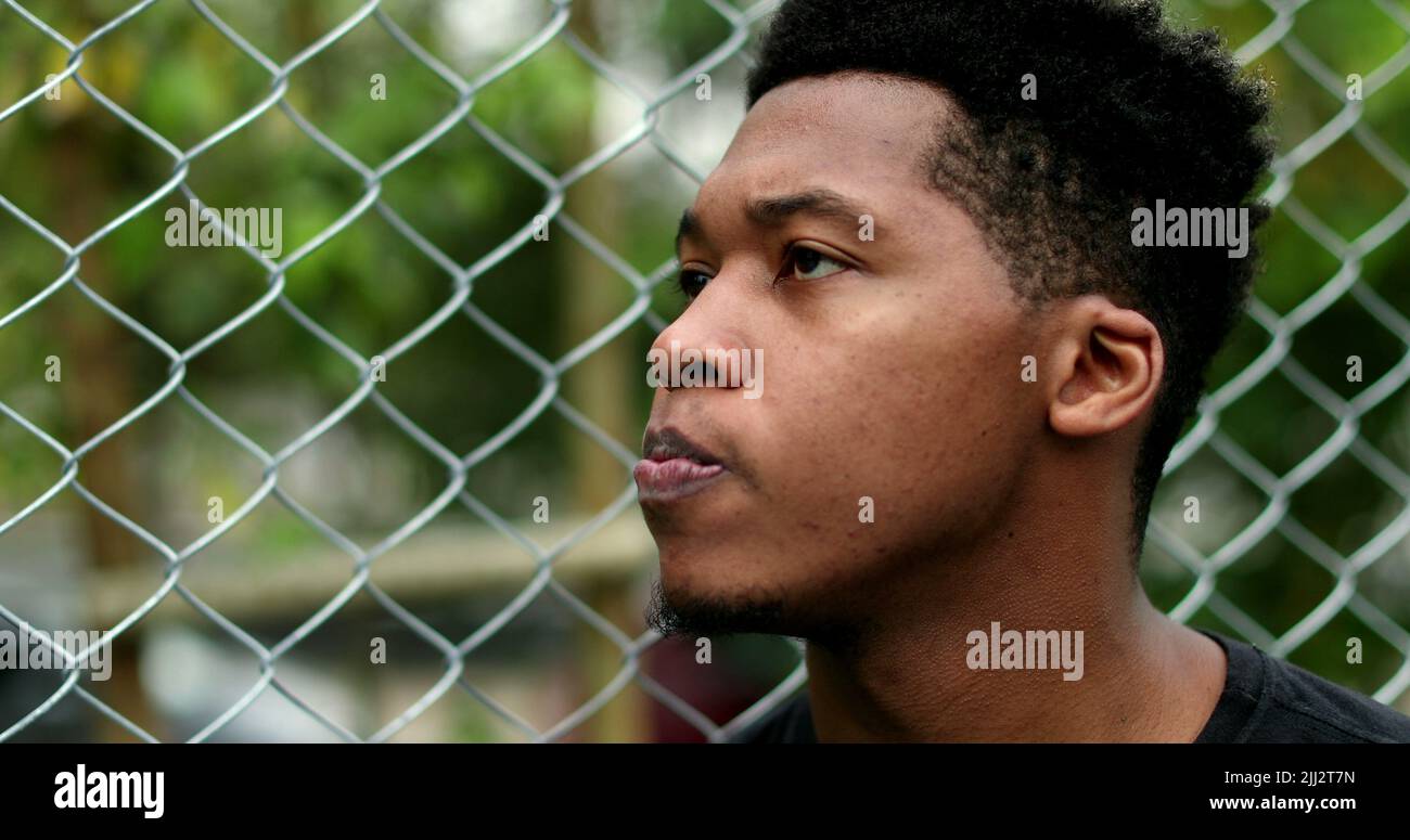 Pensive african man thinking outside hi-res stock photography and ...