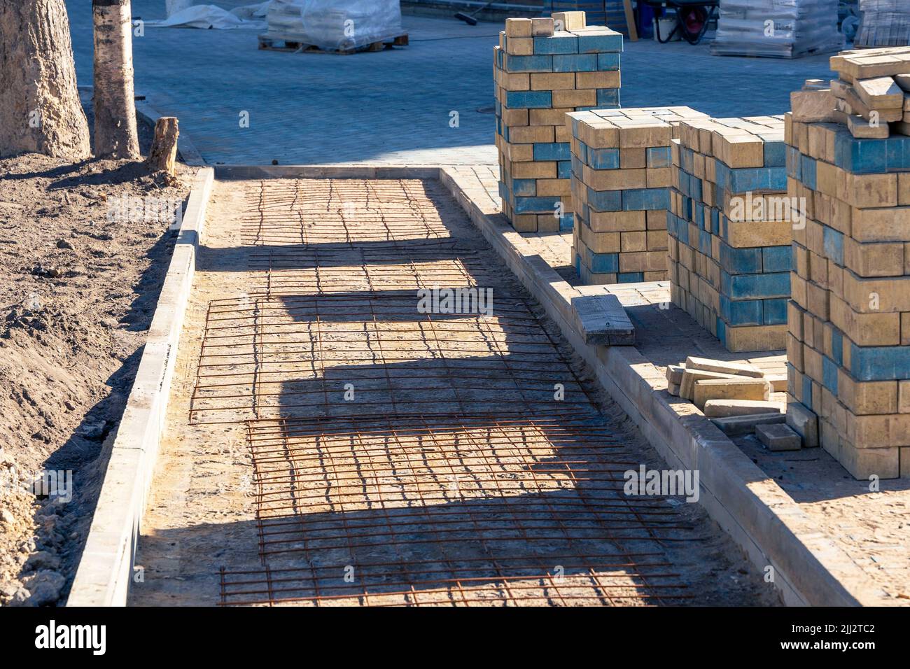 stacks of paving slabs for paving paths stacked on a construction site ...