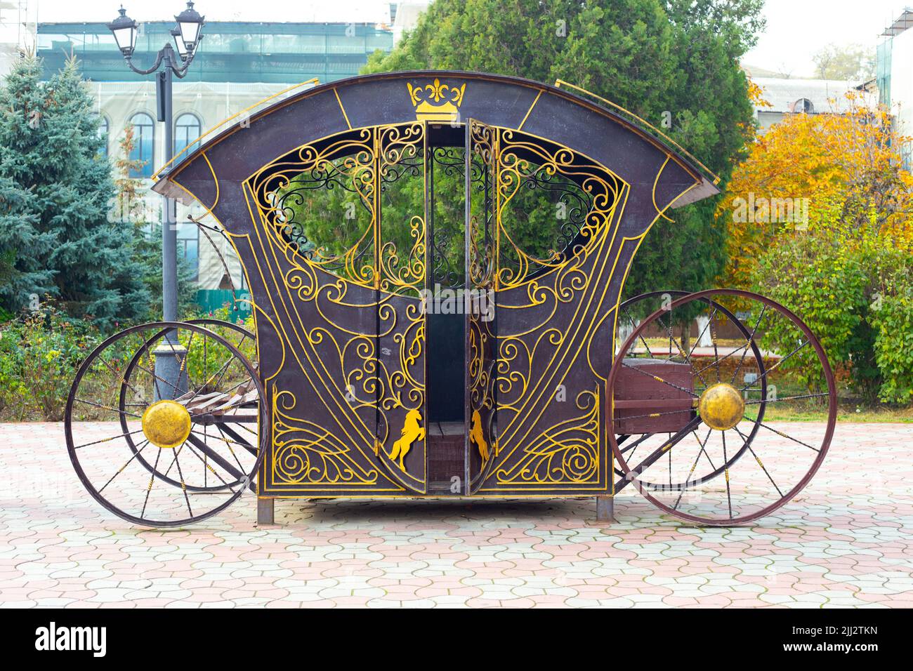 Decorative carriage from a chariot in a summer park. Walks and rest ...