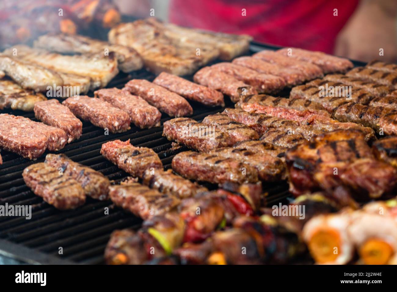 Grilling tasty food on barbecue. Steak, sausages on grill at food ...