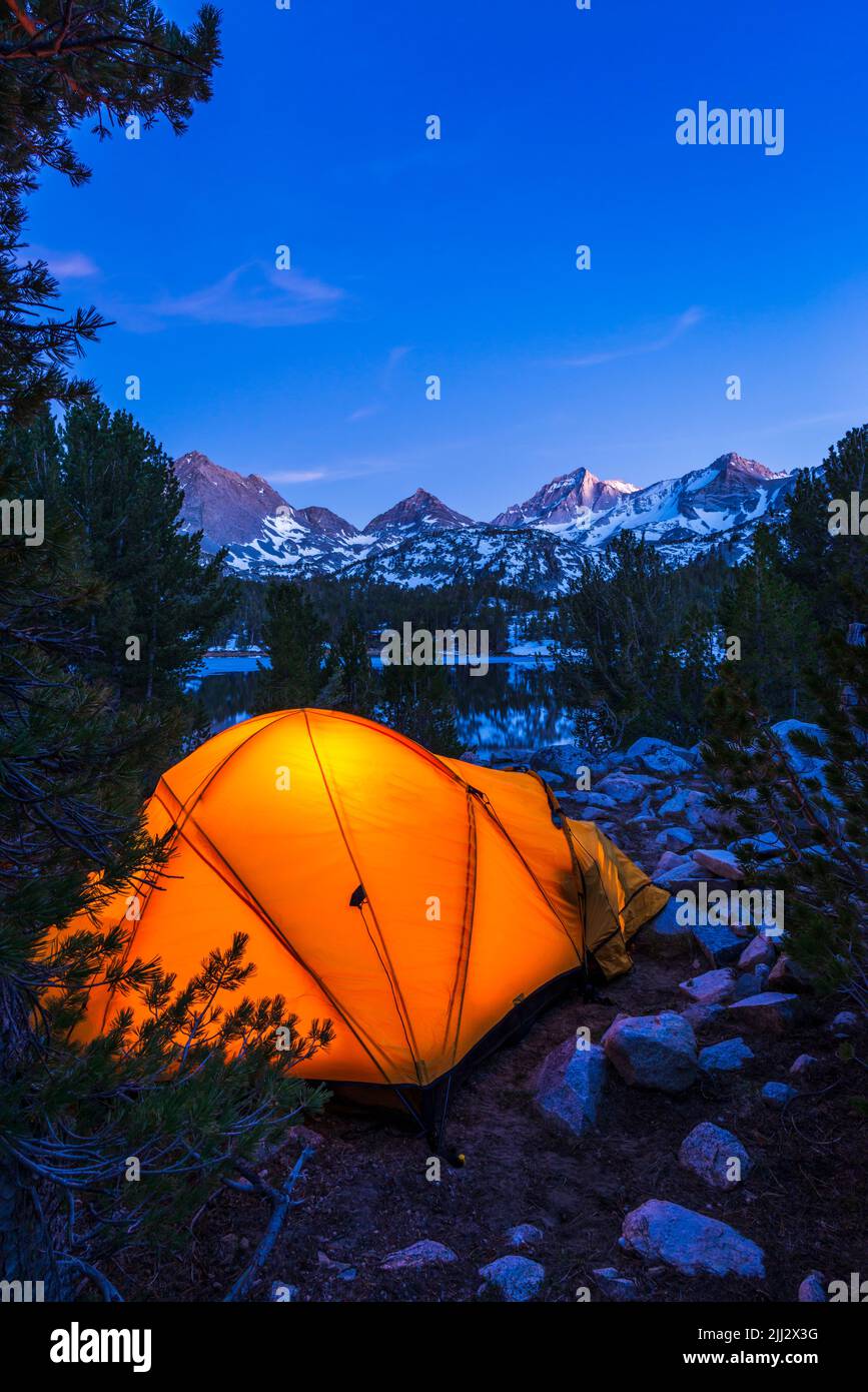 Yellow dome tent glowing at night in Little Lakes Valley, John Muir ...