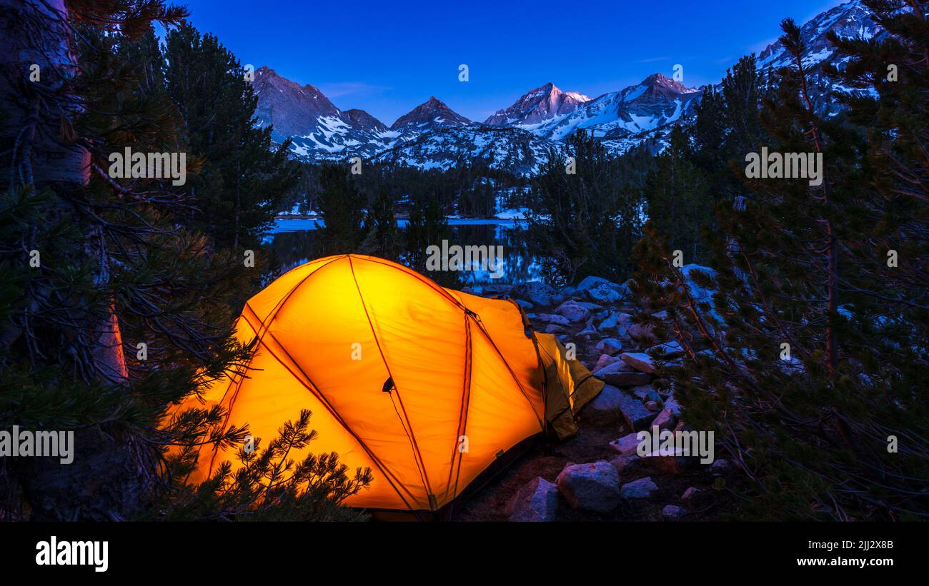 Yellow dome tent glowing at night in Little Lakes Valley, John Muir ...