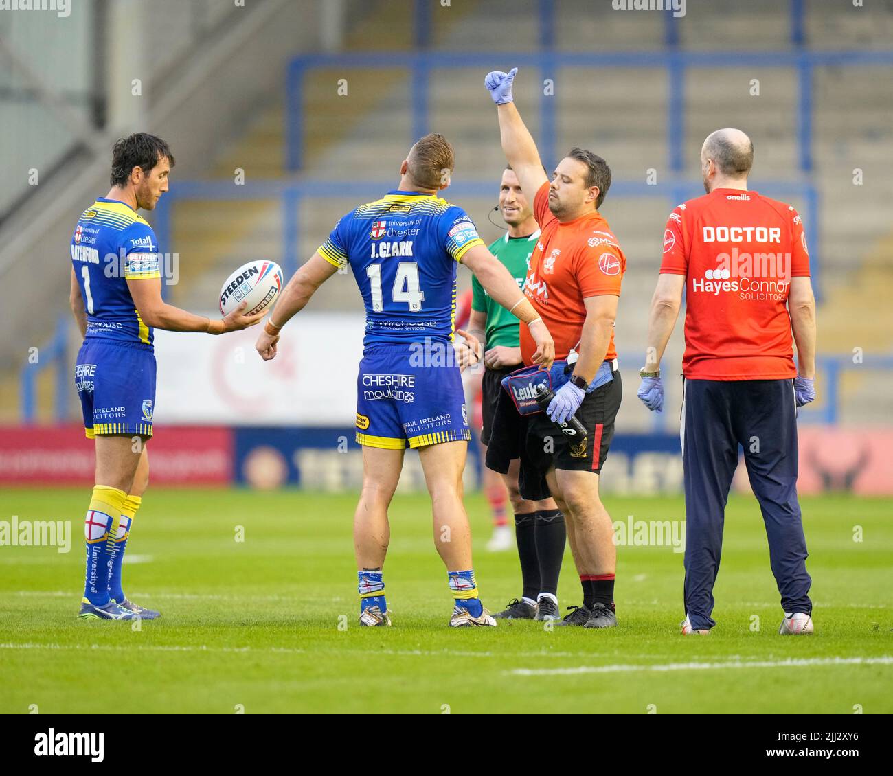Warrington Wolves medic signals Jason Clark #14 of Warrington Wolves is ...