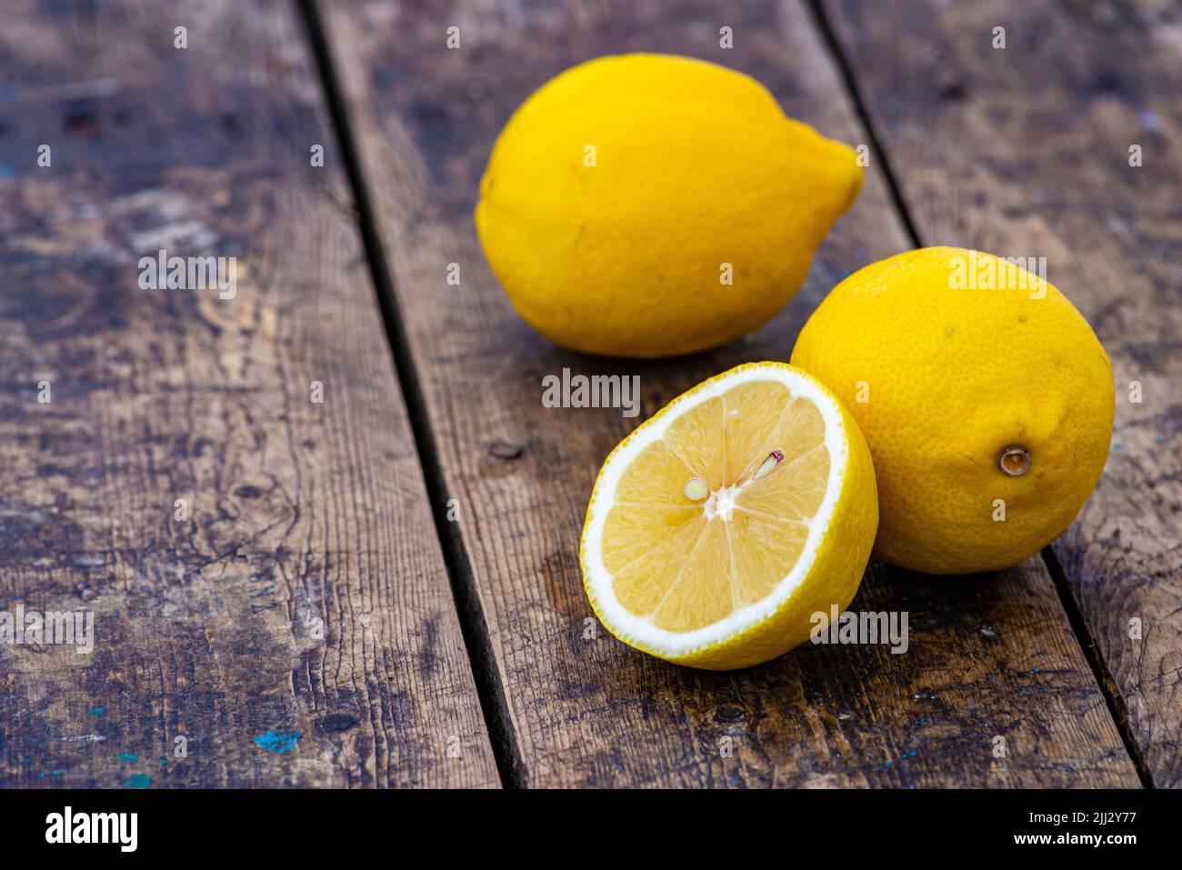 Fresh organic lemons Summer fruit, old wood table, Still Life, green ...