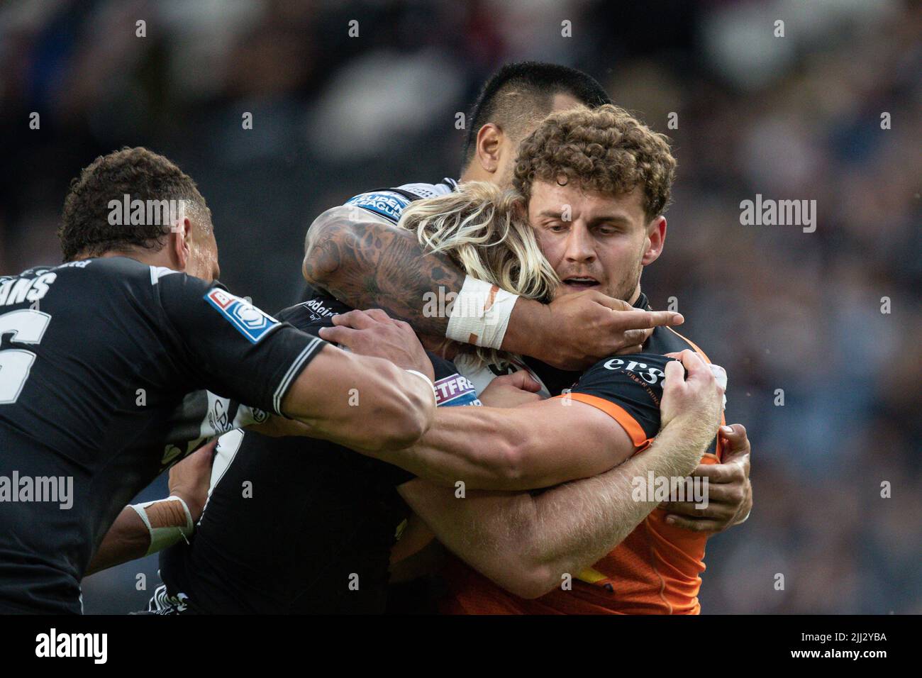 George Lawler #10 of Castleford Tigers is tackled by Brad Fash #17 of ...
