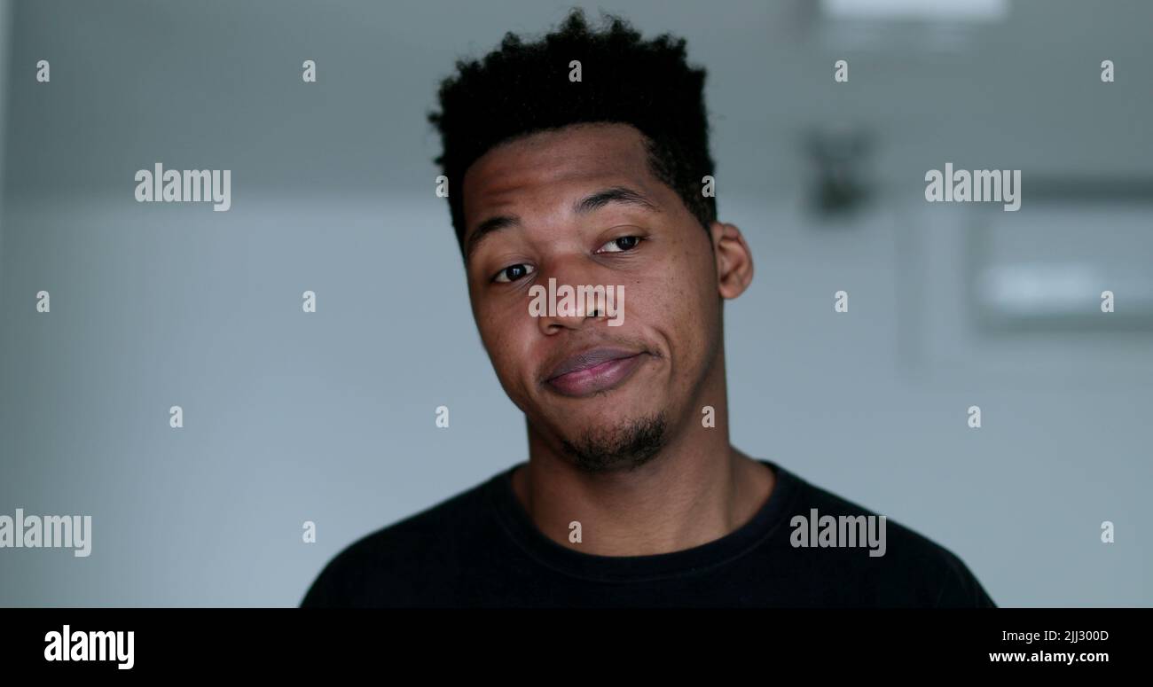Annoyed bored black man rolling eyes Stock Photo - Alamy
