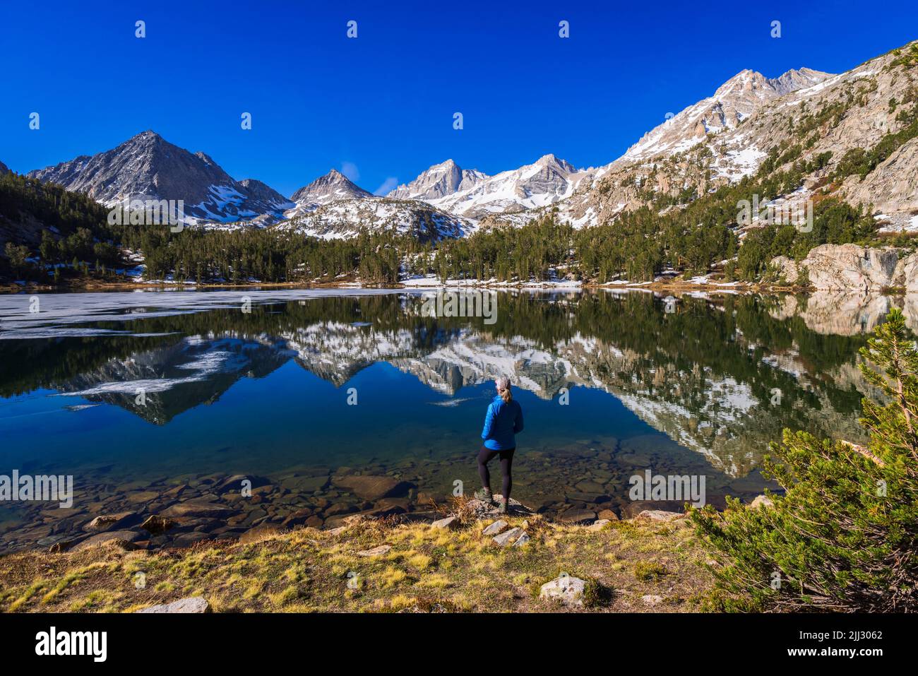 Hiker on the shore of Long Lake, Little Lakes Valley, John Muir ...