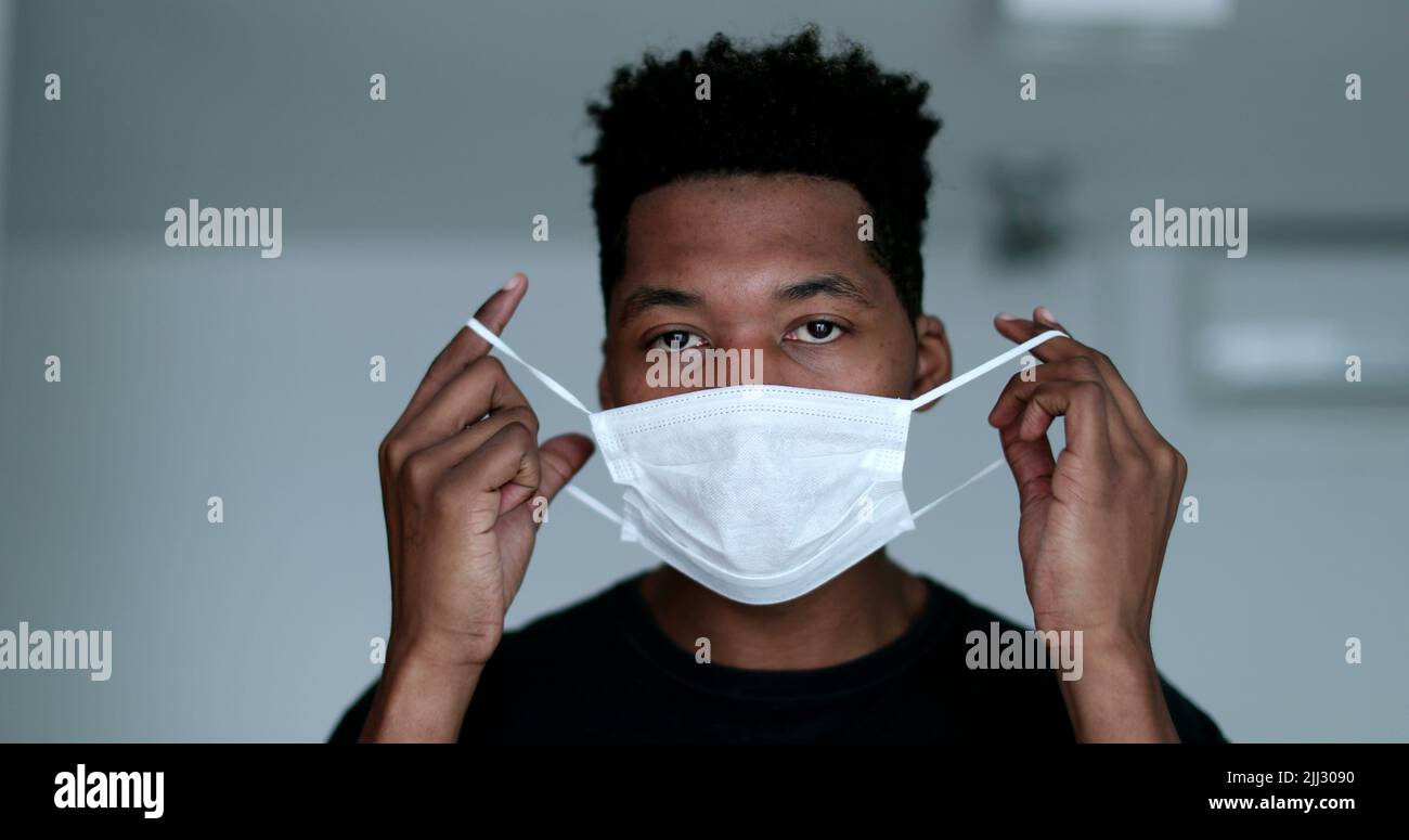 African male doctor removing his surgical mask Stock Photo - Alamy
