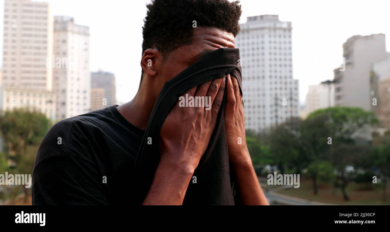 Wiping sweat from face hi-res stock photography and images - Alamy
