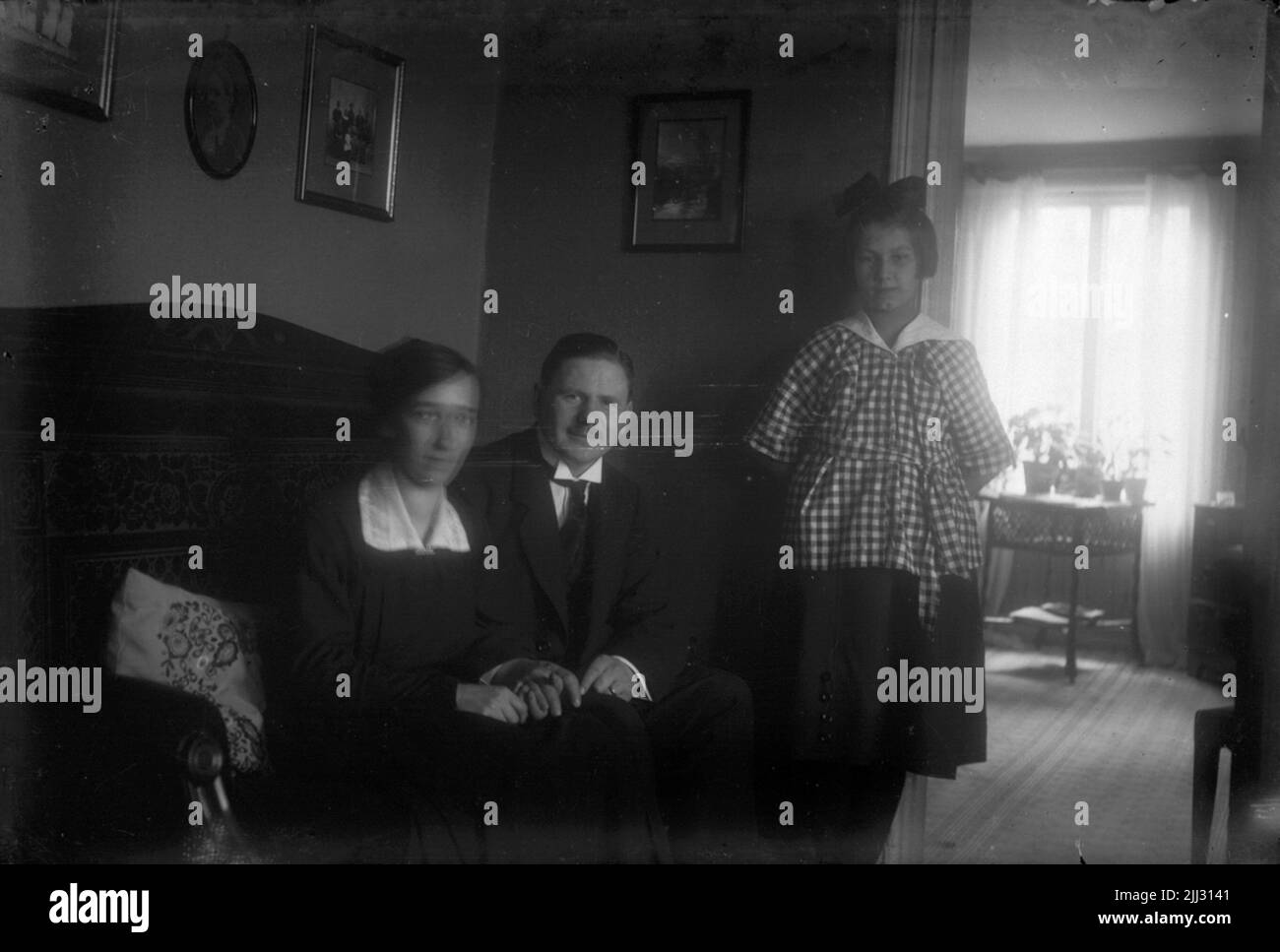 Room interior, three people Stock Photo - Alamy