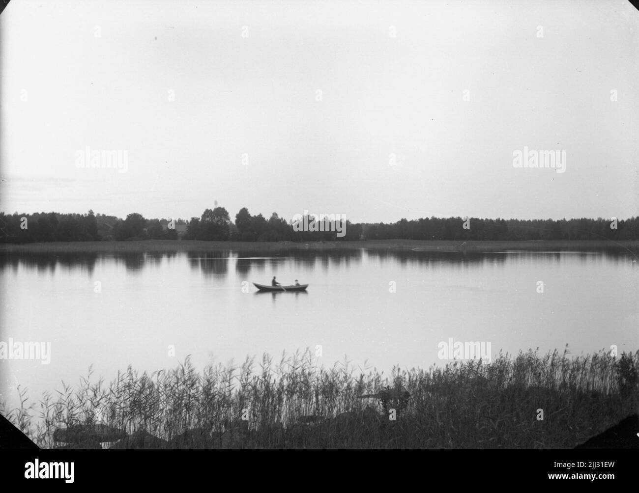 People in a rowing boat Black and White Stock Photos & Images - Alamy