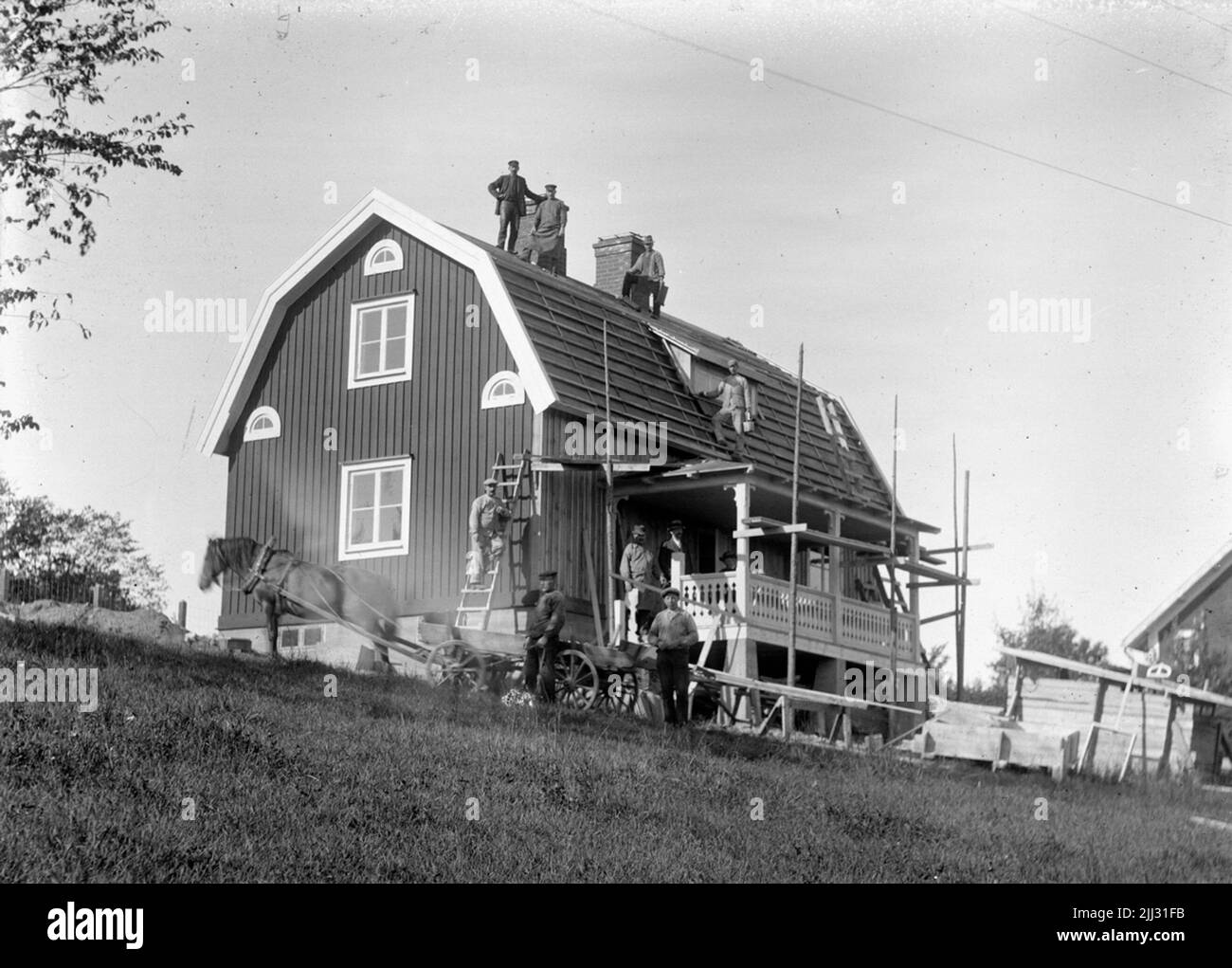Residential building, housing construction, roof work, worker, a horse ...