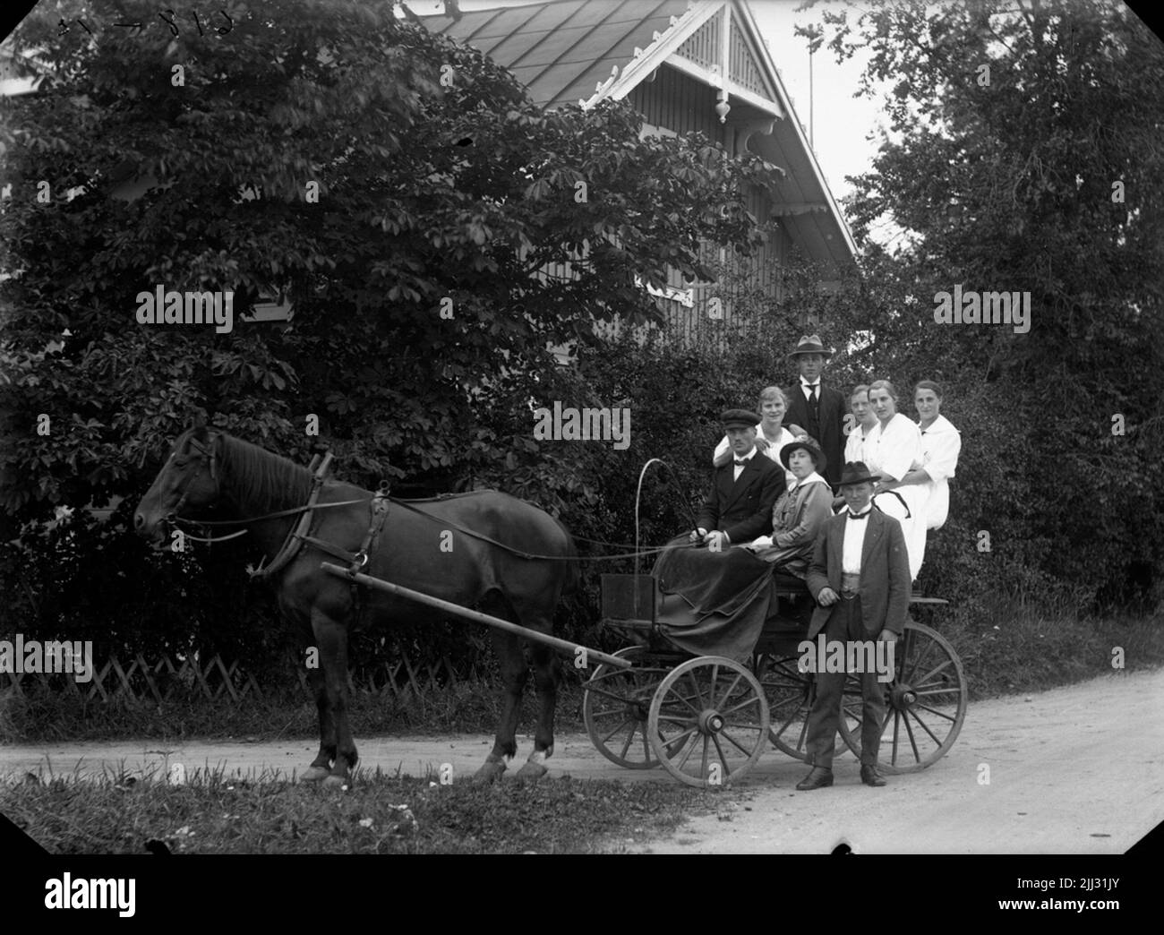 Horse with carriage, eight people Stock Photo - Alamy