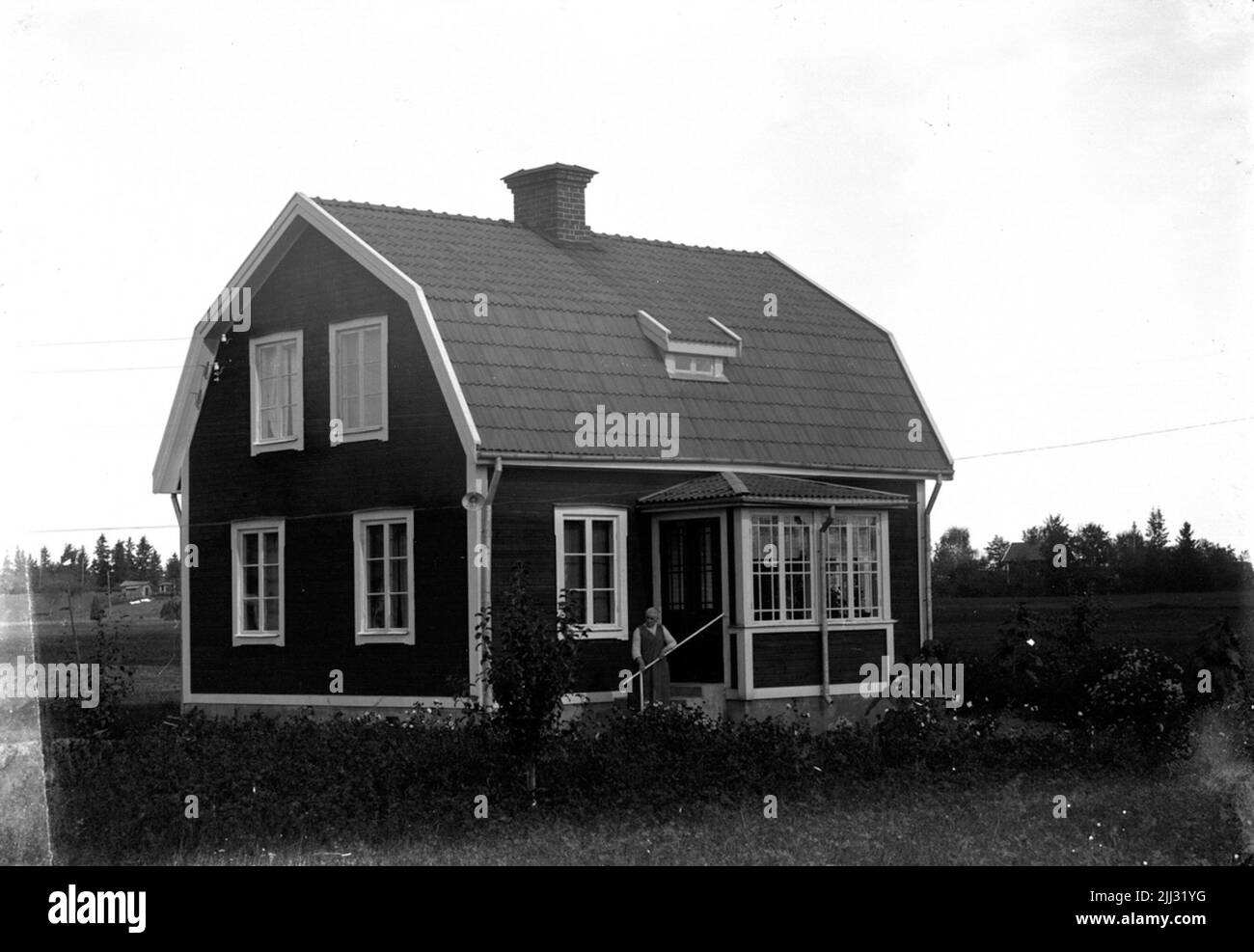 Residential building, a woman Stock Photo - Alamy