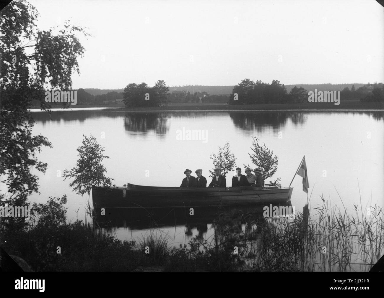 Small group of people sitting Black and White Stock Photos & Images - Alamy