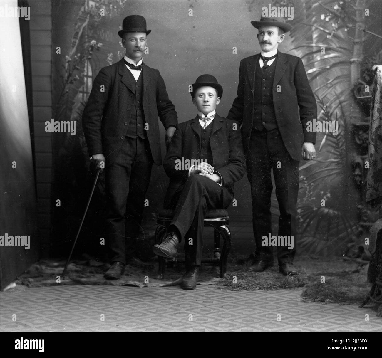 Three individuals standing on Black and White Stock Photos & Images - Alamy
