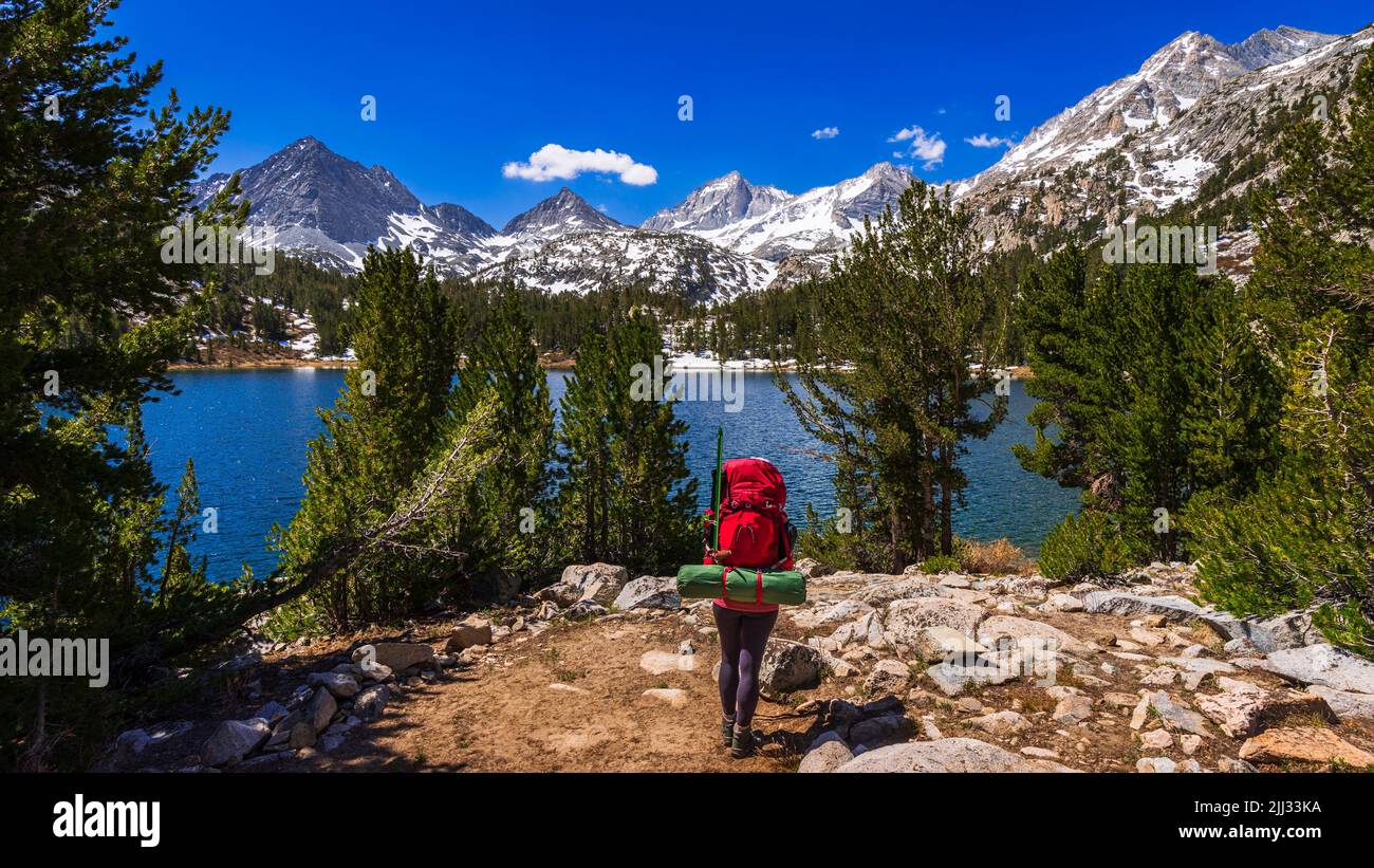 Woman backpacking at Long Lake in Little Lakes Valley, John Muir ...