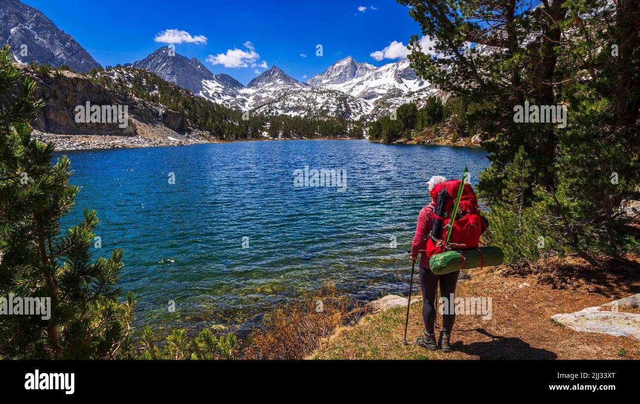 Woman backpacking at Long Lake in Little Lakes Valley, John Muir ...