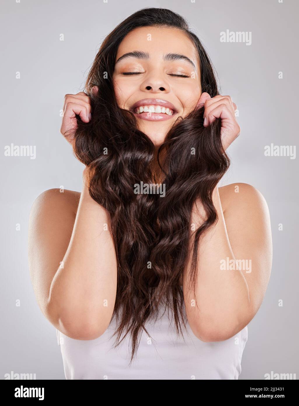 The best hairstyle is the one that looks good on you. Studio shot of a ...