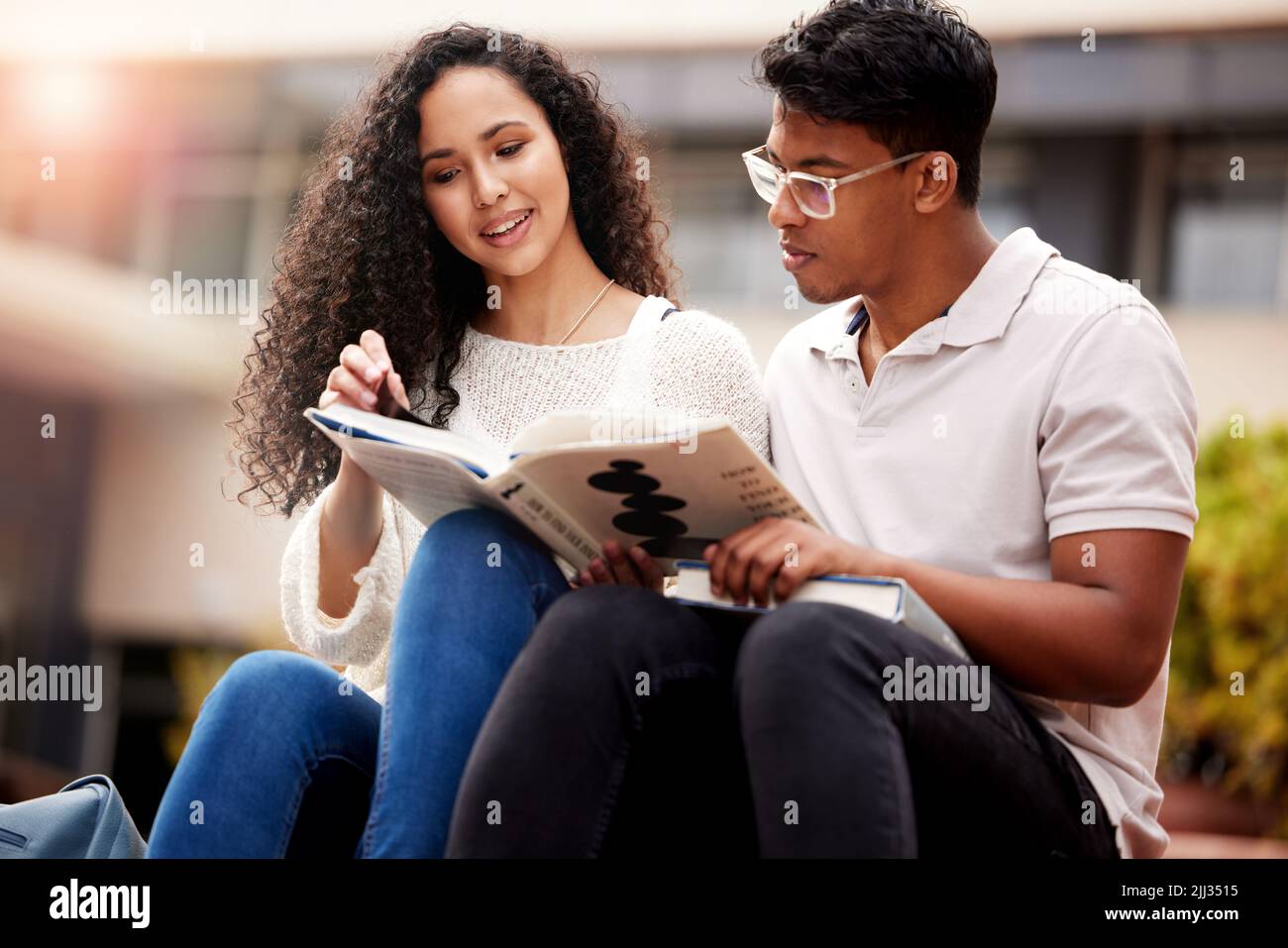 We always help each other out. two young college students at college ...